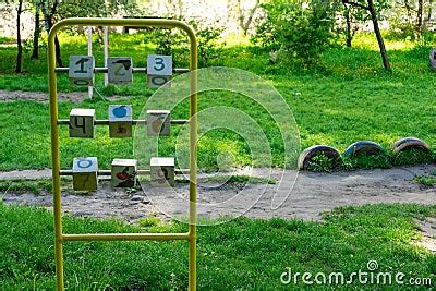 Playground Activity With Wooden Number Blocks In Bright Green Park