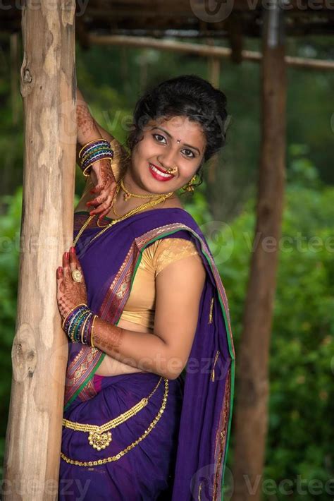Beautiful Indian Young Girl In Traditional Saree Posing Outdoors