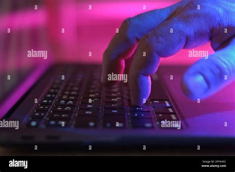 Person Typing At Laptop Computer At Night Male Uses Keyboard Shakes
