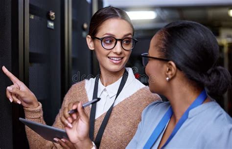 No Issues Here Two Attractive Young Female Computer Programmers Working Together In A Server