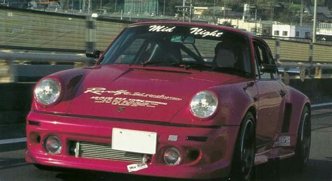 Red Sports Car Racing On The Streets