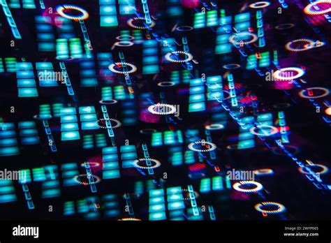 Dj Mixer In A Nightclub With A Background Of Glowing Lights From Buttons And Controllers Stock