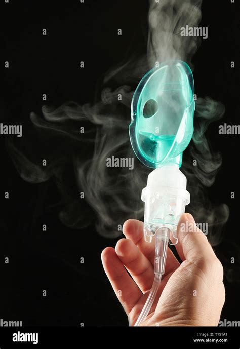 Macro Of Hand Holding Nebulizer Close Up View Stock Photo Alamy