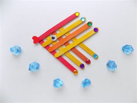 Рыбка из деревянных палочек ОригамиСан