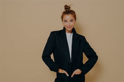 Premium Photo Attractive Young Model Female In Black Suit With Hair