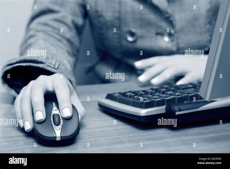 Female Hand Holding Computer Mouse Stock Photo Alamy