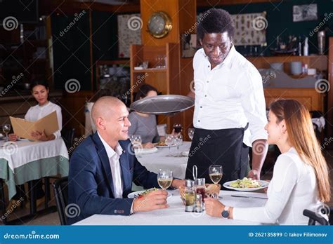 African American Waiter Bringing Ordered Dishes To Couple Stock Image Image Of Bringing