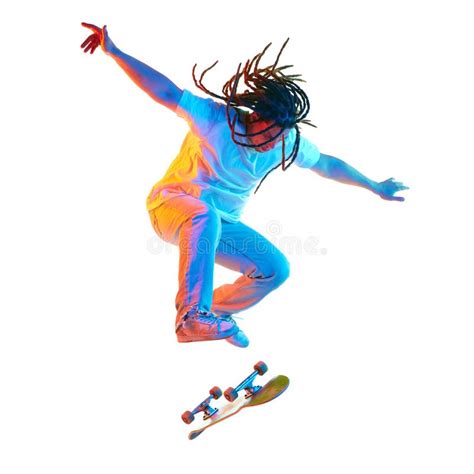 Young Man Doing Freestyle Modern Tricks On Skateboard In Mixed Neon