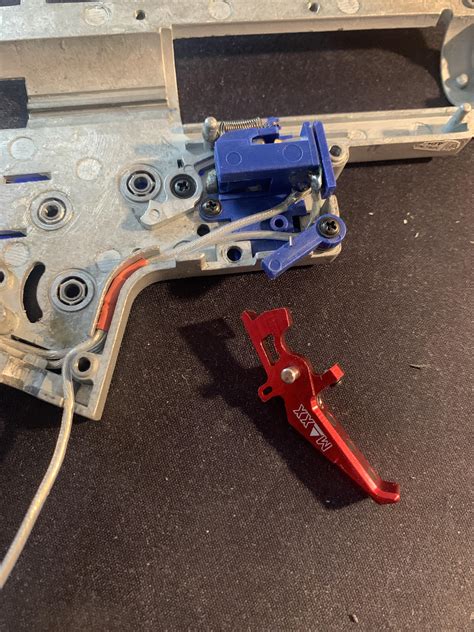 How Do I Install This Trigger In There The Trigger Has The Thing In The Front And The Stock One