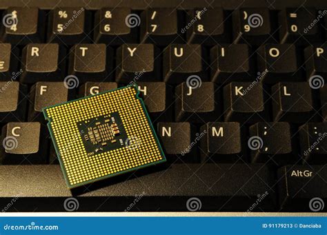 Close Up Of Computer Processor CPU On A Keyboard Background Tecnology Concept Stock Image