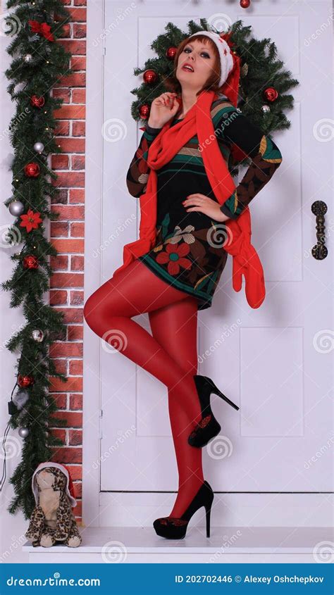 Legged Redhead Model In Minidress And Red Pantyhose Posing In Studio Stock Photo Image Of