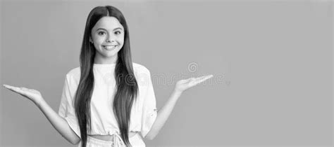 Happy Teen Girl Presenting Product Making Choice On Blue Background