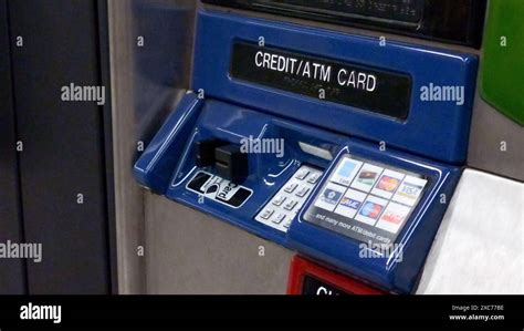 Blue Atm Card Reader With A Slot For Inserting A Card And A Numeric