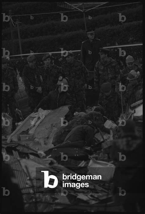 Image Of Loc0123dec88 Rescue And Army Personel Remove A Piece Of By