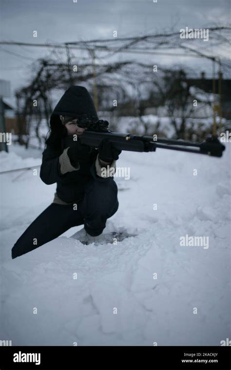 A Beautiful Woman Holding Rifle And Take Aim Ready To Shoot Target