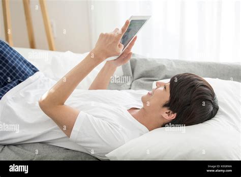 Man Lying Down In Bed