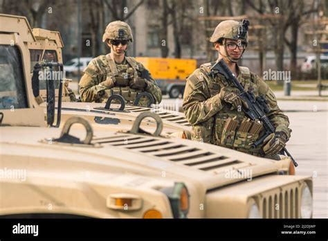 United States Marine Corps Soldiers With Shotguns Or Rifles Helmets And Armored Vehicles Humvee