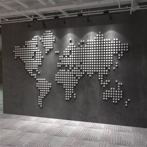 A Large Metal World Map Mounted To The Side Of A Wall