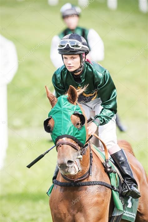 Woman Jockey Into A Curve At The Nationaldags Galoppen In Gardet