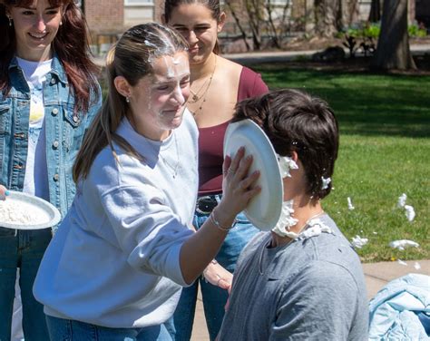 Members Of Chi Phi Fraternity And Chi Omega Sorority At Franklin And Marshall College Take A Pie