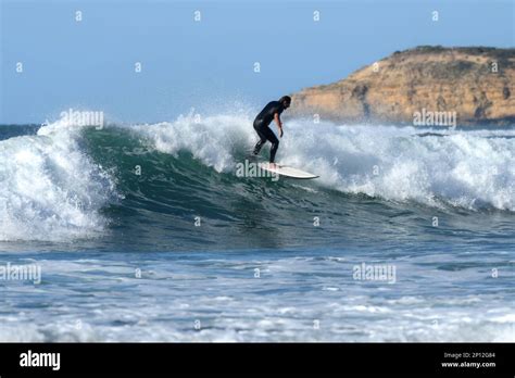 Surfing South Side Of Bells Beach With Cliff Background Near Torquay