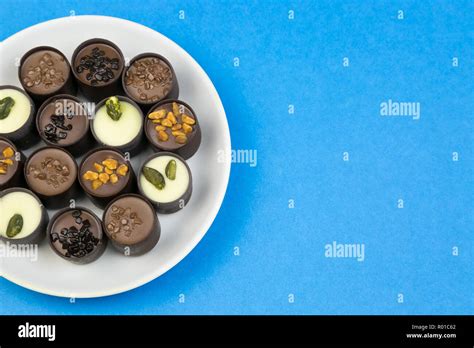 Sweet Beautiful Candy Lying On A Plate On A Bright Color Background