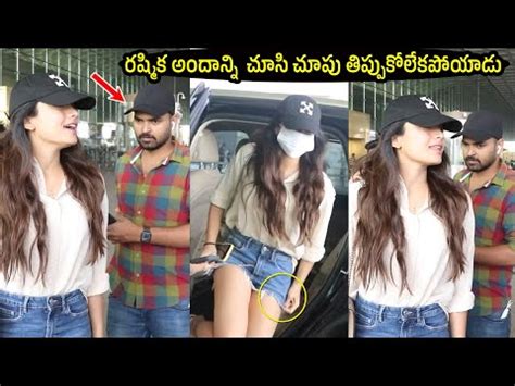 Rashmika Mandanna Stuns In White Shirt And Blue Denim Shorts At Airport