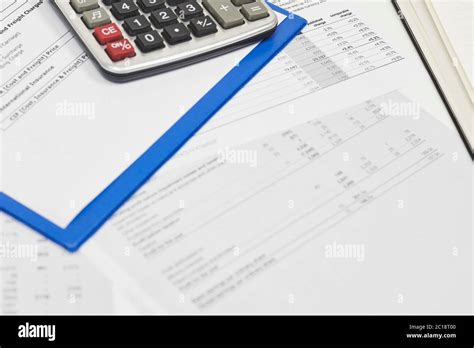 Calculating Export Import Cost Stack Of Statistic Data Calculator And Notepad Detailed
