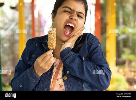 An Indian Female Facing Dental Sensitivity Problem While Eating Ice