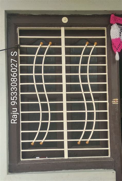 Pink Crocheted Scarfs On White Iron Bar Decorated Front Door