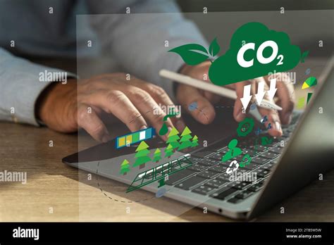 Businessman Working Computer To Reduce Co2 Depicting The Issue Of Carbon Dioxide Net Zero And