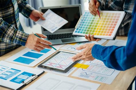 Premium Photo Ux Developer And Ui Designer Brainstorming About Mobile