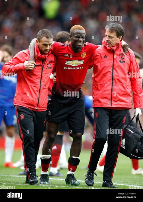 Manchester Uniteds Eric Bailly Is Helped Off The Pitch After Suffering