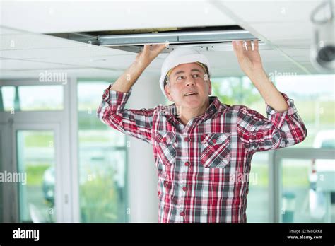 Man Install Suspended Ceiling In House Stock Photo Alamy