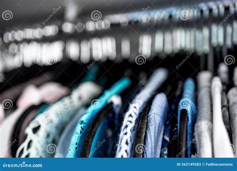 organizing and tidying up wardrobe with colour coded selection of