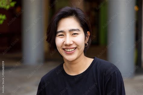 Happy Friendly Asian Non Binary Lgbt Person Smiling To Camera Stock