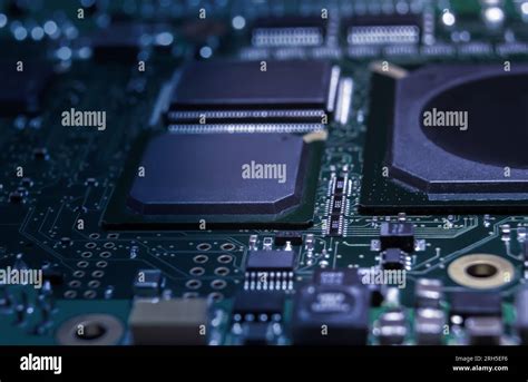 Intricate Circuit Board With Computer Hardware Showcasing Complexity Of Electronics Industry