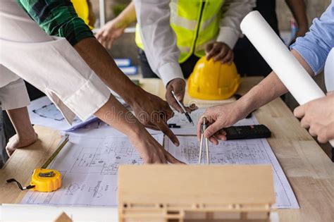 Engineer Pointing At Blueprint And Using Laptop To Draw Project Design Building Construction