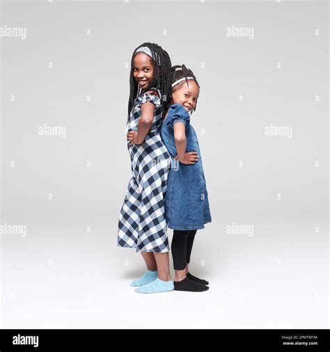 Two Beautiful African American Girls With Intricate Braids Pose