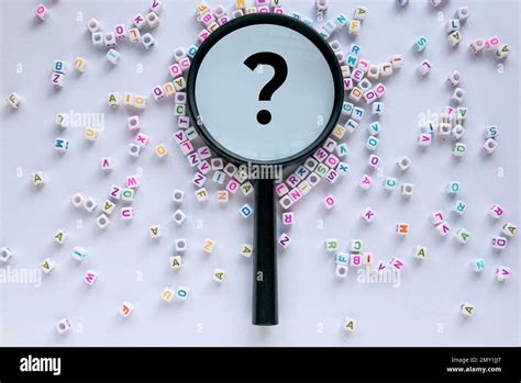Questions And Answers Concept Alphabet Beads With Magnifying Glass With Question Symbol In It
