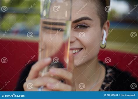 Cute Young Woman Posing With A Glass Bottle Of Water Portrait Of A