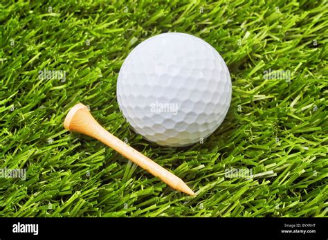Golf Ball On Tee Grass