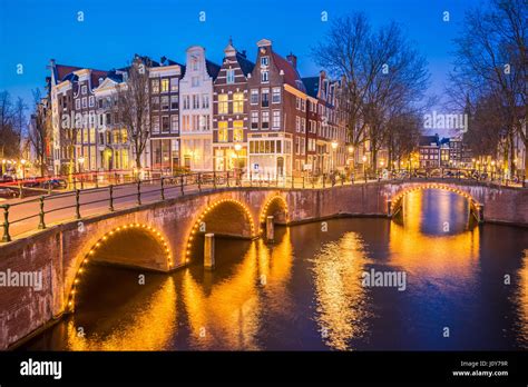 Night View Of Amsterdam City Skyline At Night In Netherlands Stock