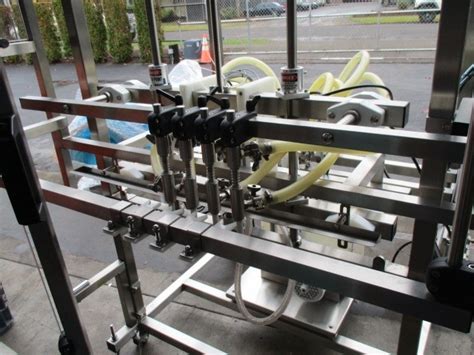 Inline Filling Systems Overflow Filling Line With Capper And Labeler