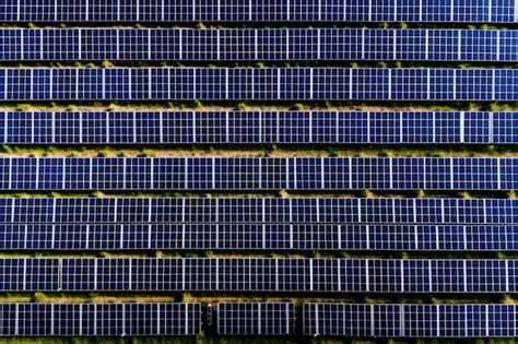 Premium Ai Image Solar Farm With Multiple Rows Of Solar Panels In A