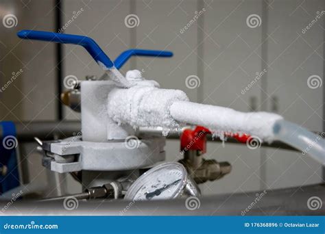 Frozen Pipes And Valves On High Pressure Nitrogen Tank In A Science Lab