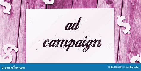 Text Ad Campaign On Text Paper Signs Of Dollar On Wood Table Business Concept Stock Image