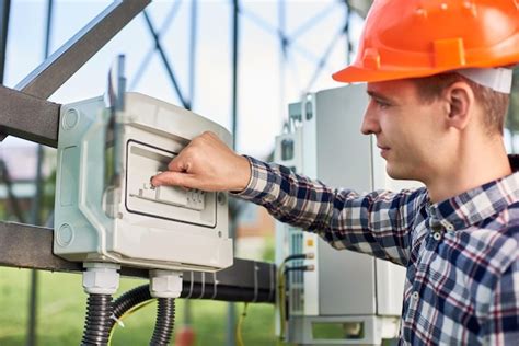 Premium Photo Close Up Of Hand Man Pushing Button At The Electrical Equipment On Solar Power