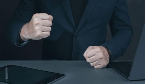 Premium Photo Businessman Pounding Fist On Table Cropped Image