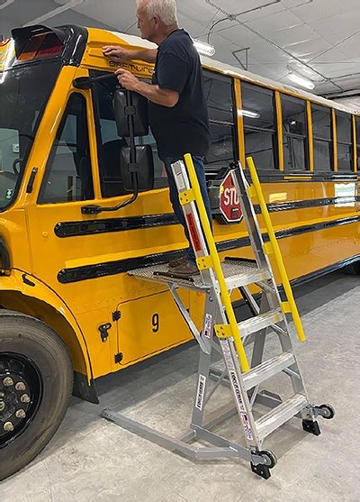 Using Correct Ladder Stands Prevent Falls In The Bus Maintenance Shop